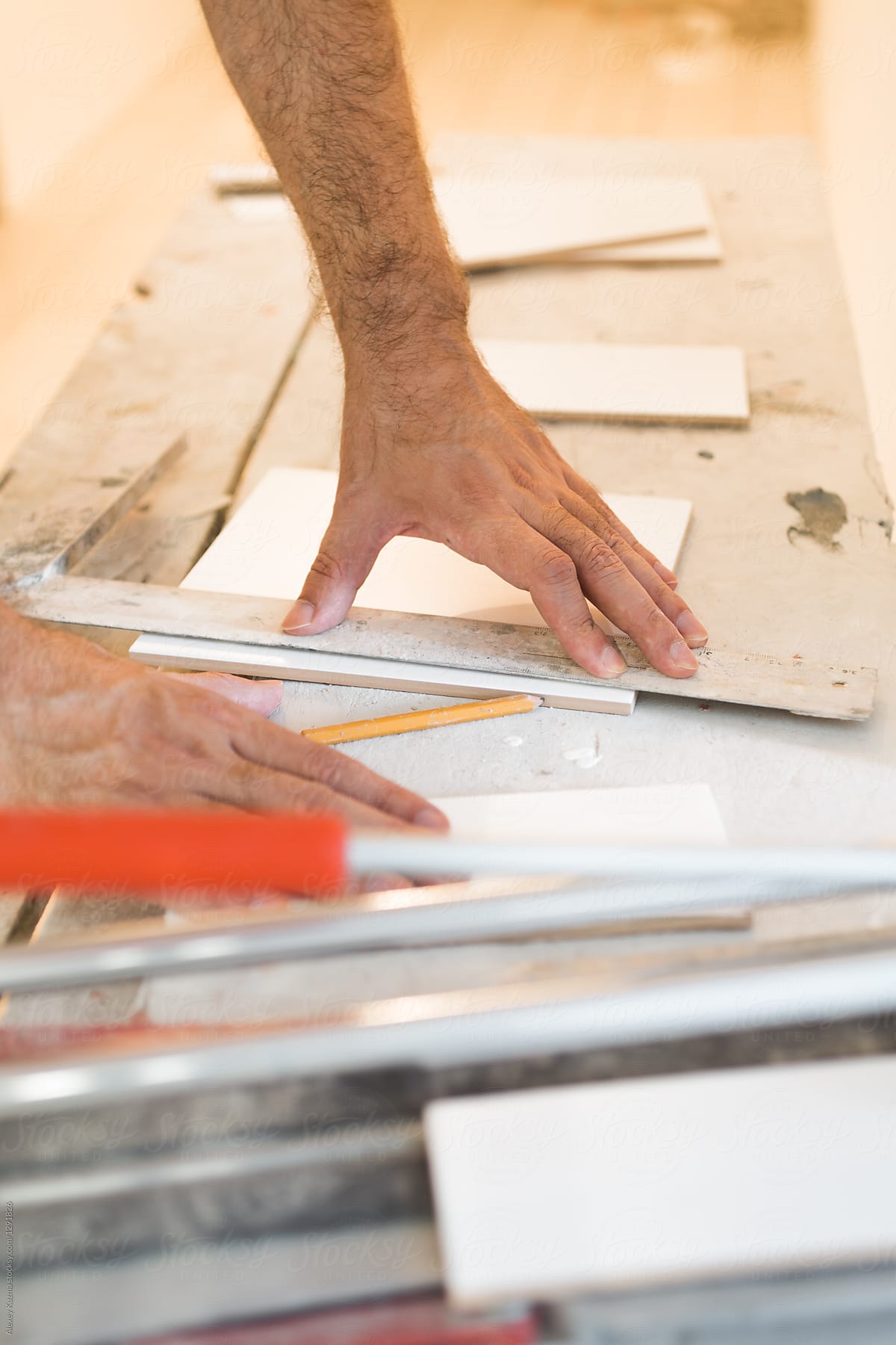 "Hands Of Worker With Tiles" by Stocksy Contributor "Alexey Kuzma ...