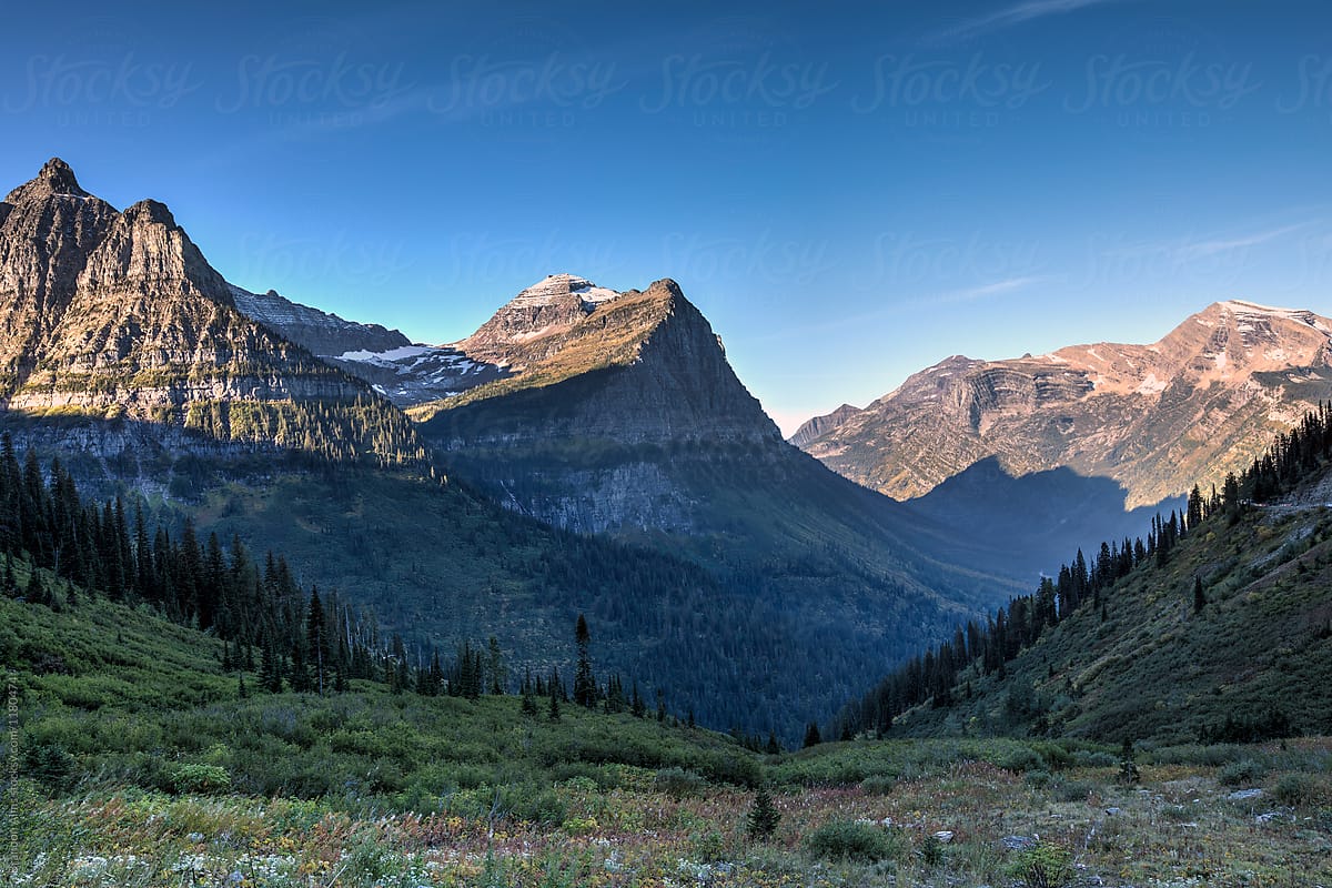 "Sunlit Mountain Peaks In Montana" by Stocksy Contributor "Brandon Alms ...