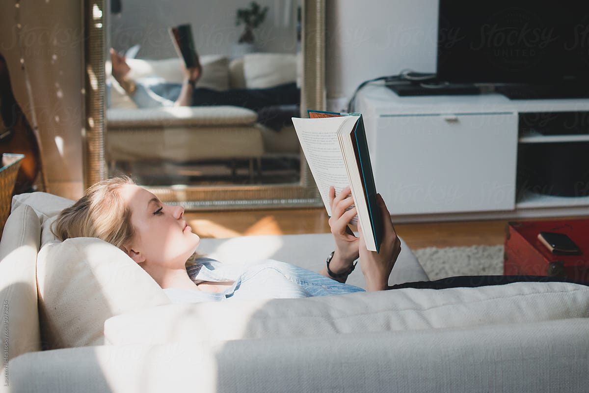 "Reading At Home" by Stocksy Contributor "Lauren Lee" - Stocksy