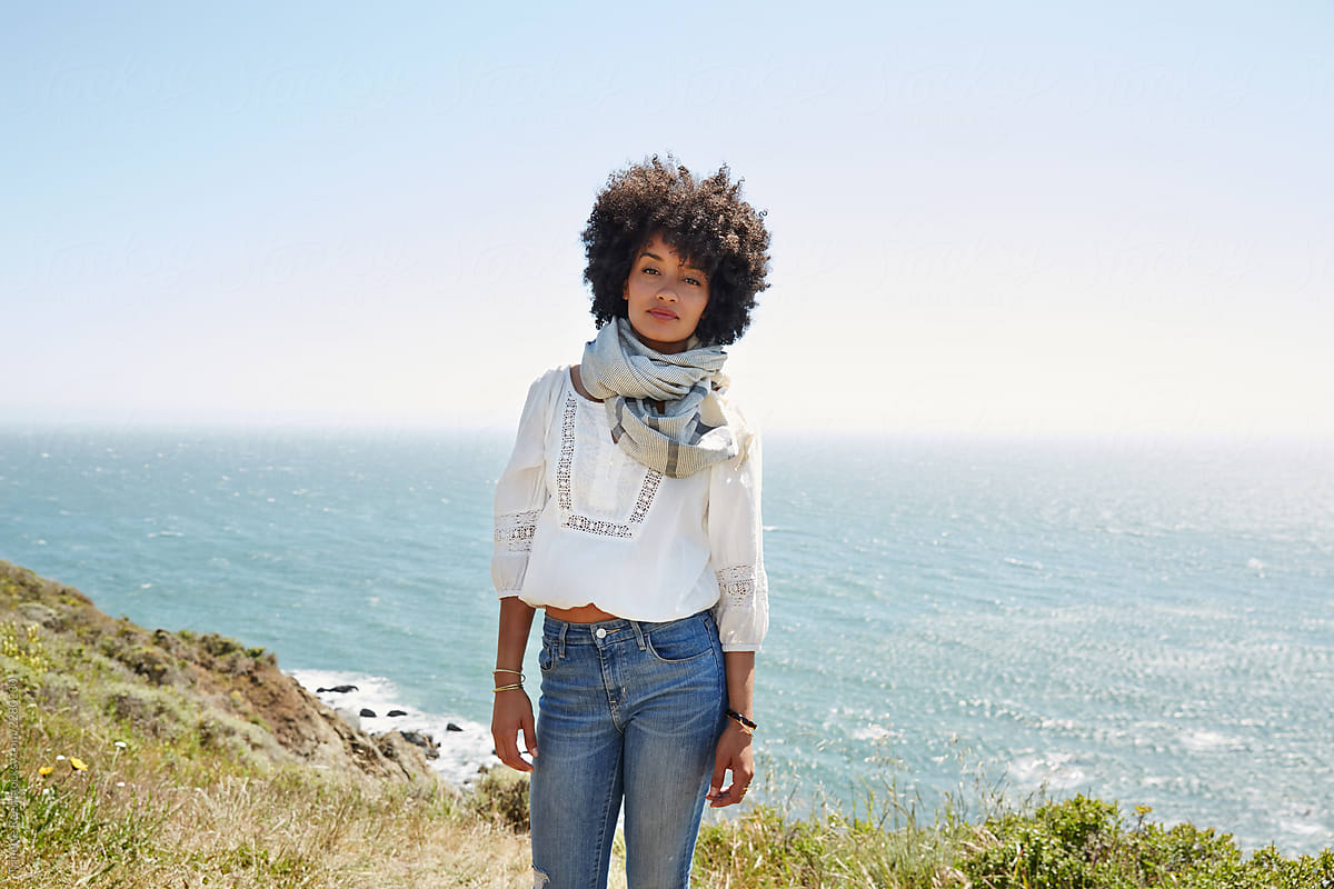 "Portrait Of African American Woman Standing On A Cliff Above The Ocean ...