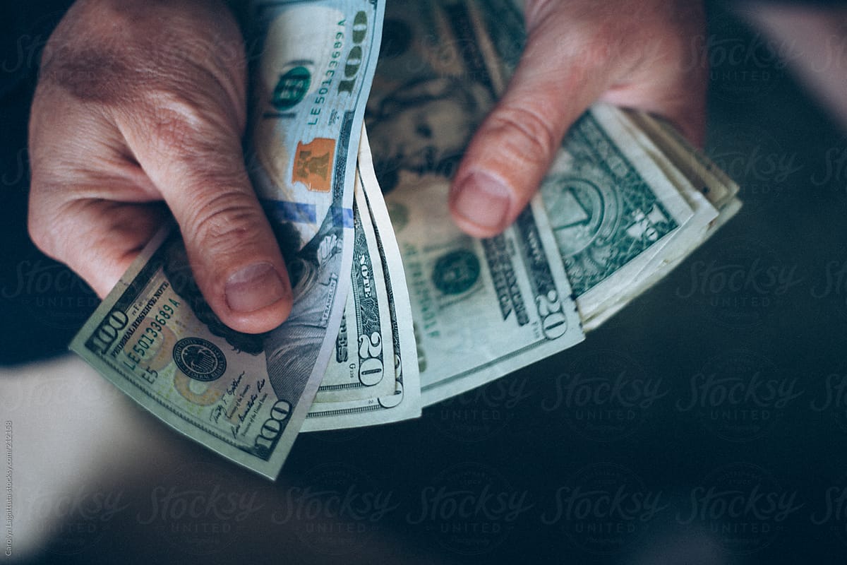"Lots Of Cash" by Stocksy Contributor "Carolyn Lagattuta" - Stocksy