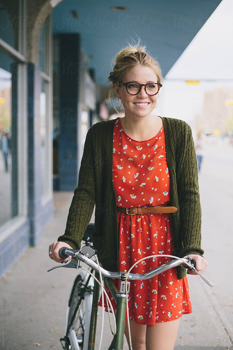 "Smiling Woman Standing Outdoors With A Bike" by Stocksy Contributor "A ...