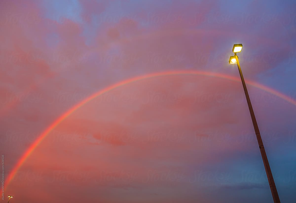 "Rainbow And Parking Lot Lights" by Stocksy Contributor "ALAN SHAPIRO ...