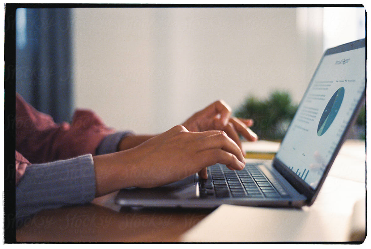 "Woman Preparing Financial Report" by Stocksy Contributor "Milles Team ...