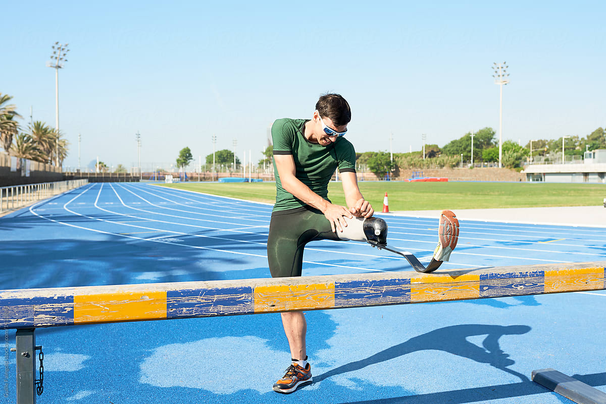 "Paralympic Sportsman Stretching Before Running" by Stocksy Contributor ...