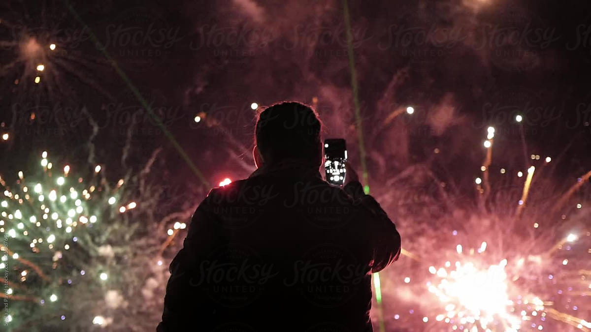 "Young Man Watching Fireworks Culmination" by Stocksy Contributor ...