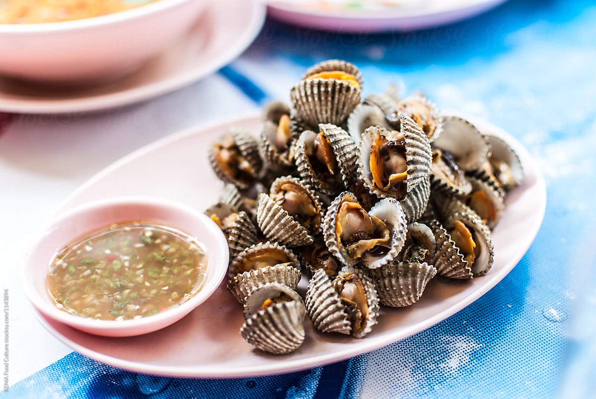 "Cockles With Thai Sauce" by Stocksy Contributor "Marta Mauri" - Stocksy