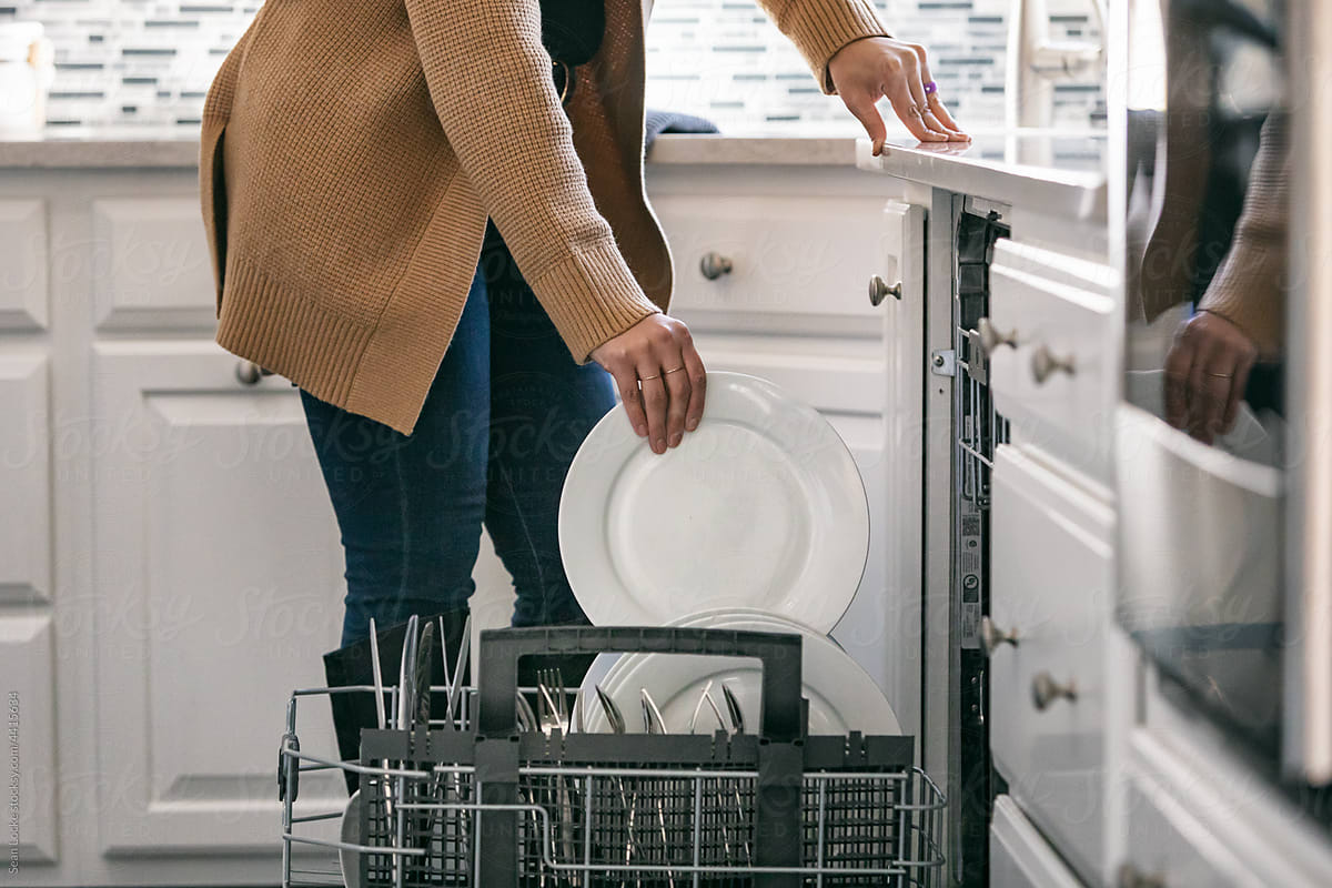 "Kitchen: Woman Removing Clean Plate" by Stocksy Contributor "Sean ...