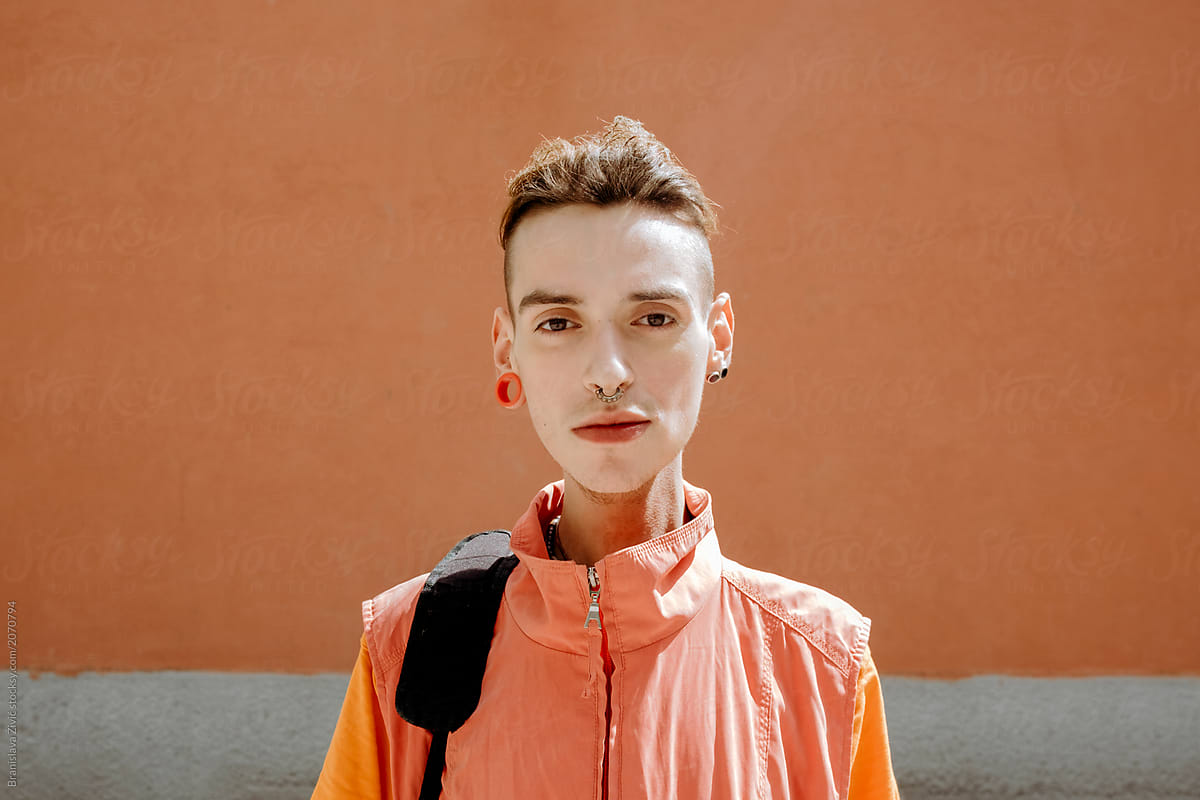"Portrait Of A Young Man In An Orange Outfit" by Stocksy Contributor ...