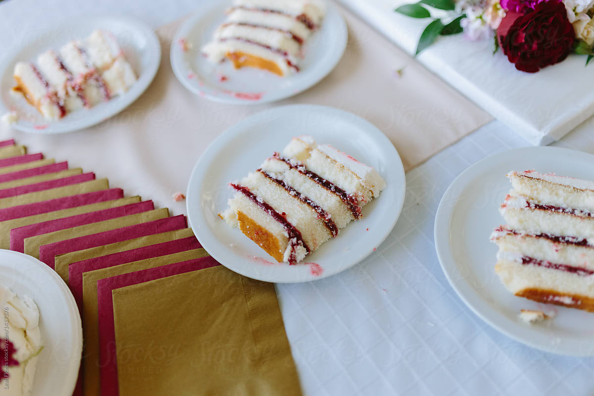 "Slice Of Wedding Cake With Red And Gold Details" by Stocksy ...