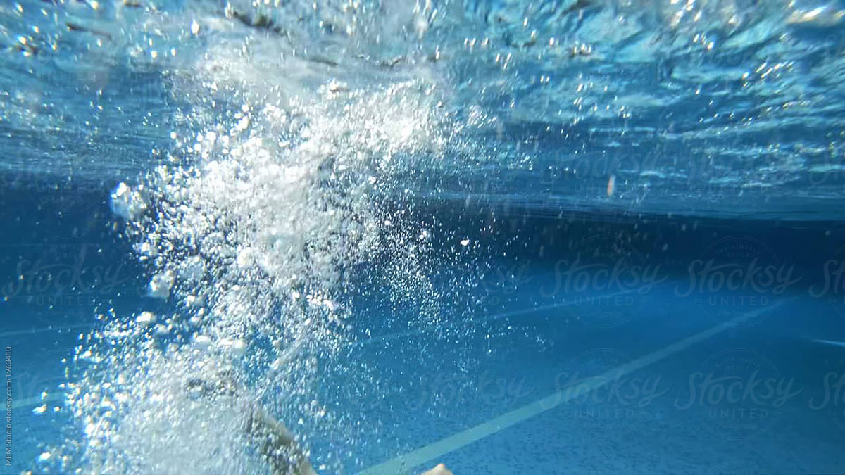 "Female Swimming In Bubbles Underwater" by Stocksy Contributor "MEM ...