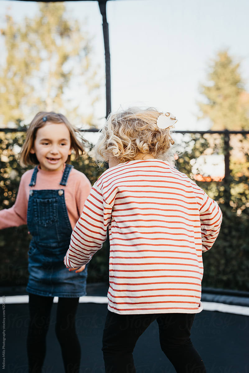 "Two Kids On A Trampoline" by Stocksy Contributor "Melissa Milis ...