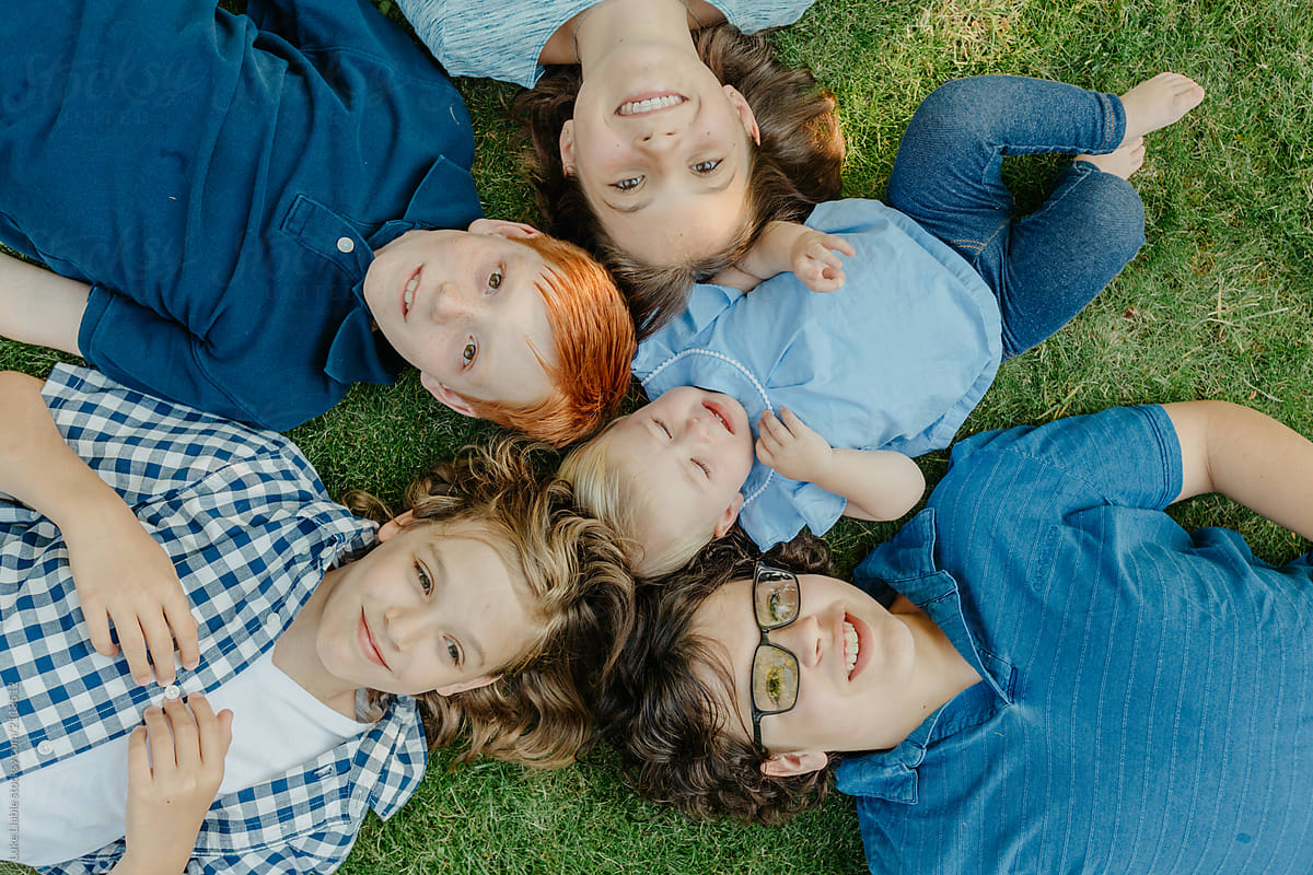 "Kids Laying On Their Backs Smiling In Summer" by Stocksy Contributor ...