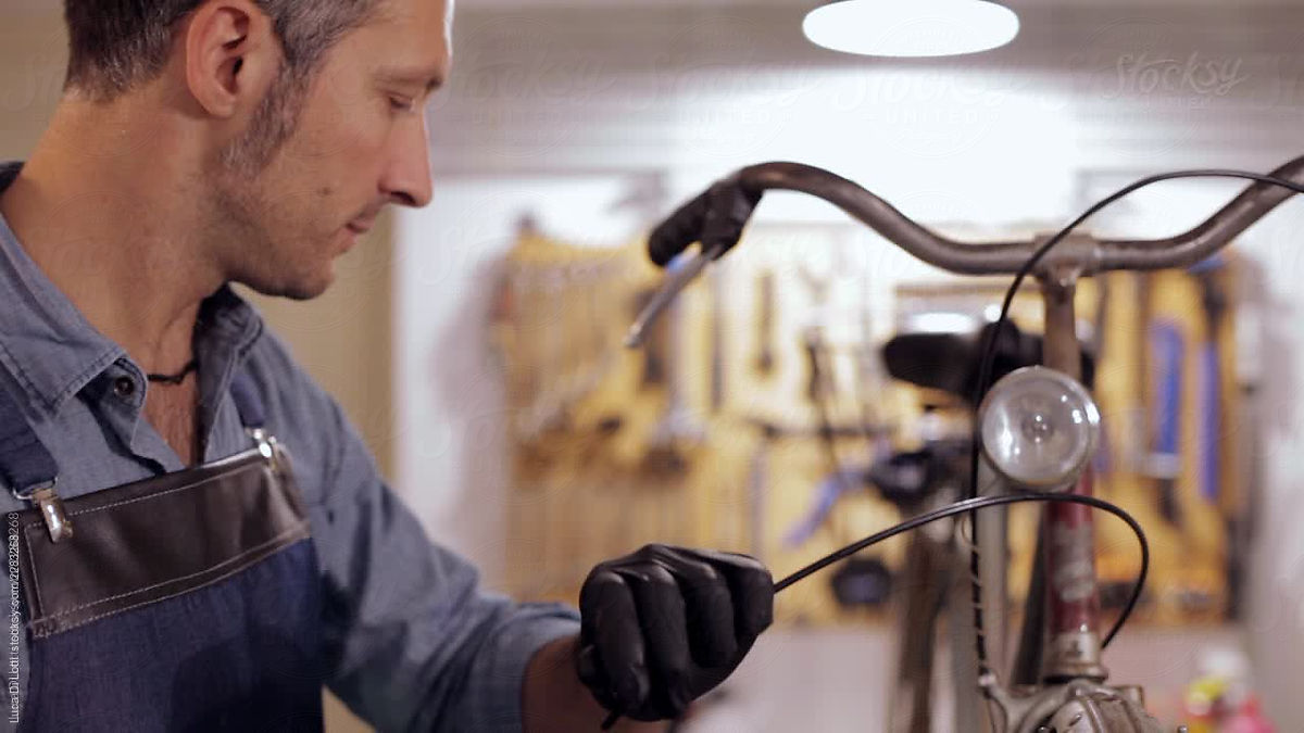 "Artisan Repairing A Vintage Bicycle" by Stocksy Contributor "Luca Di ...