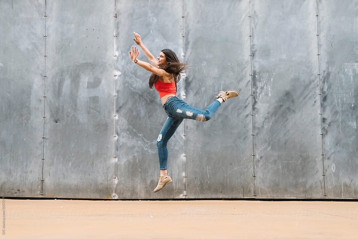 "Woman Jumping Against A Wall" by Stocksy Contributor "Koganami Studio ...