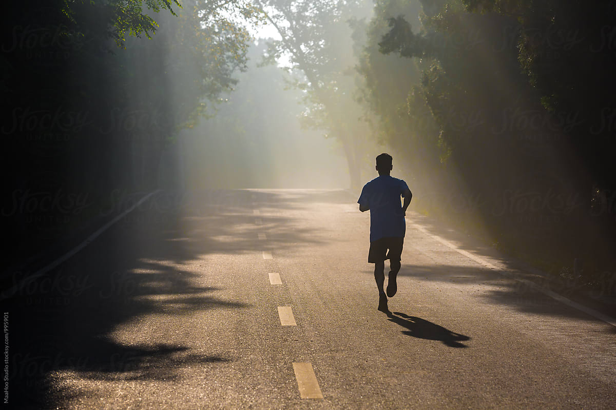 "Man Running In The Morning" by Stocksy Contributor "MaaHoo" - Stocksy