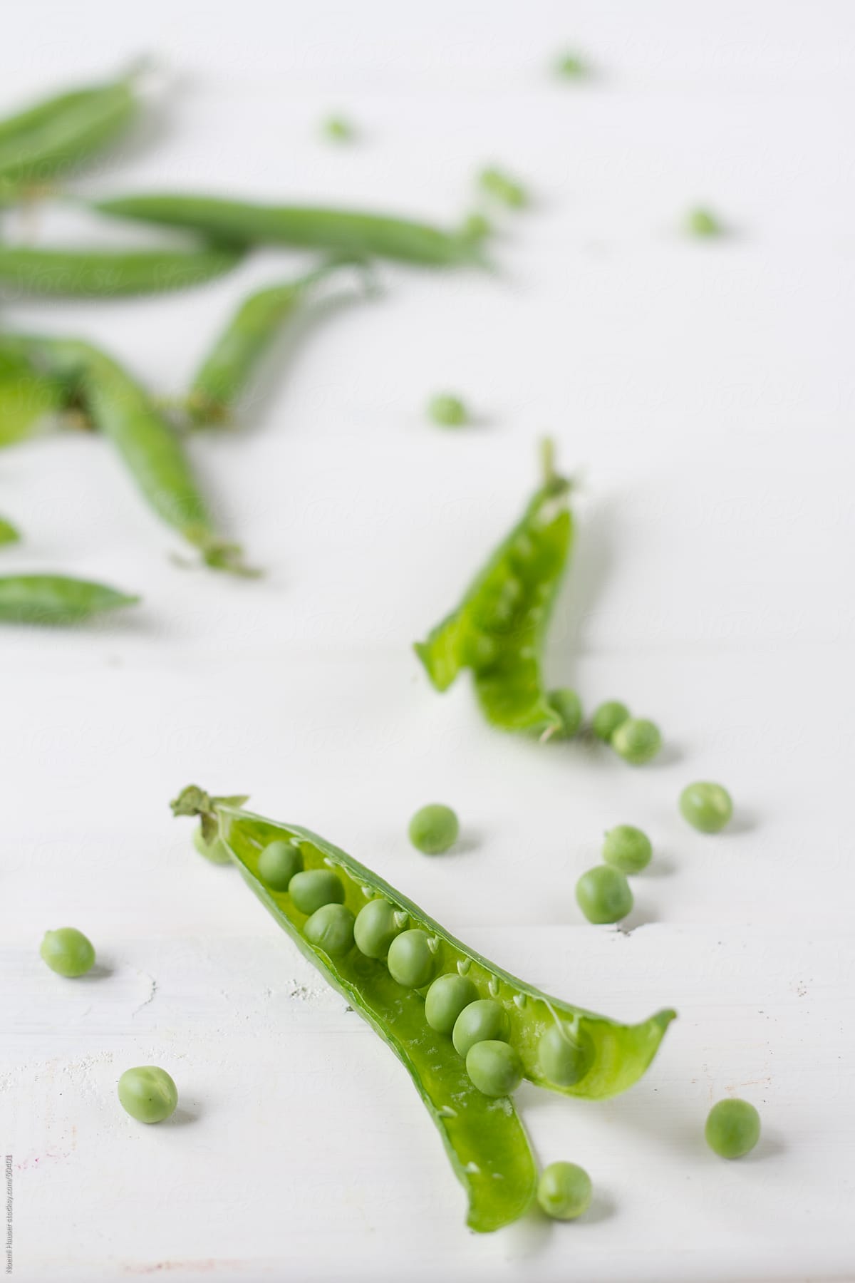 "Green Pea In Pod" by Stocksy Contributor "Noémi Hauser" - Stocksy