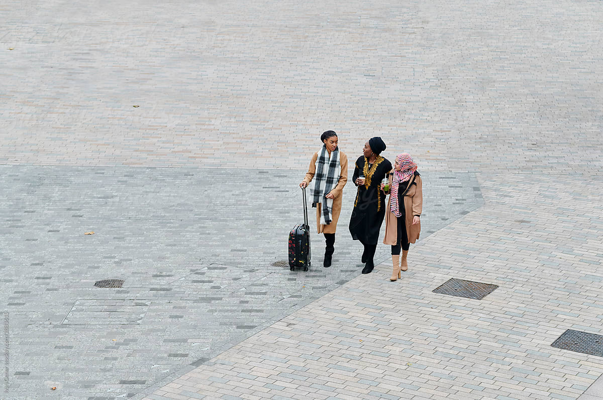 "Muslim Women Walking In A City Plaza" by Stocksy Contributor "Ivan ...