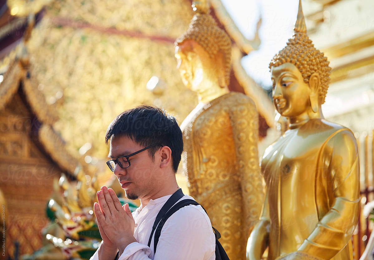 "Asian Man Praying In Thai Temple" by Stocksy Contributor "ChaoShu Li ...