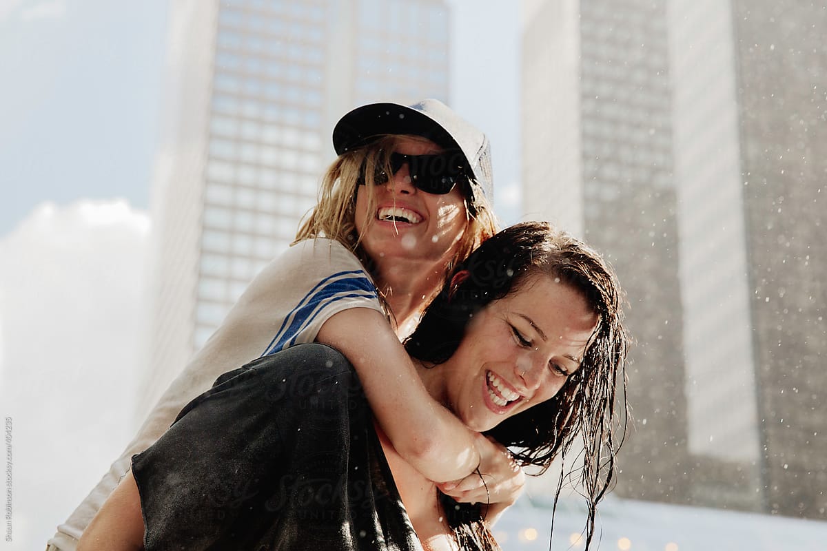 "Two Friends In The Rain" by Stocksy Contributor "Shaun Robinson" - Stocksy