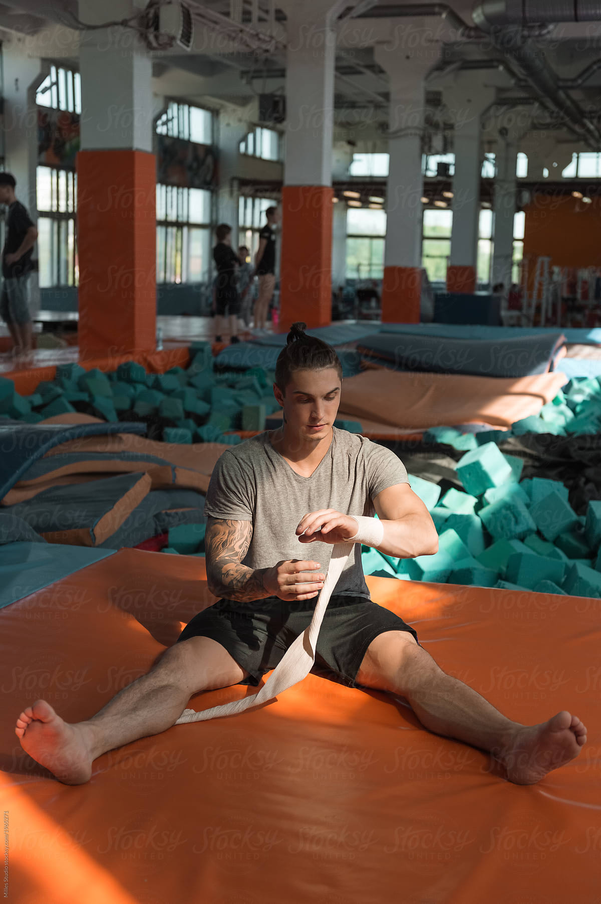 "Man Wearing Elastic Band In Gym" by Stocksy Contributor "Milles Team ...