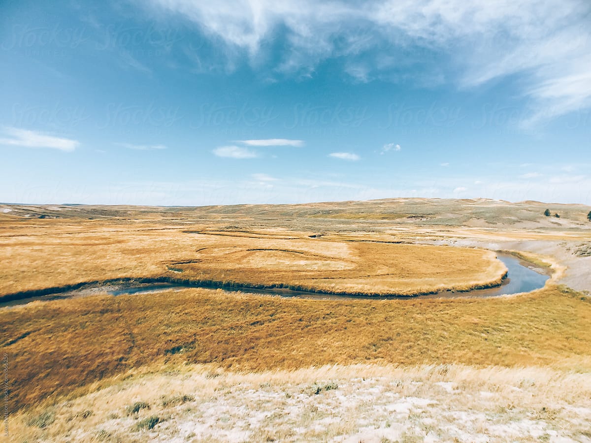 "Calm River Winding Through Open Plains" by Stocksy Contributor "Luke ...