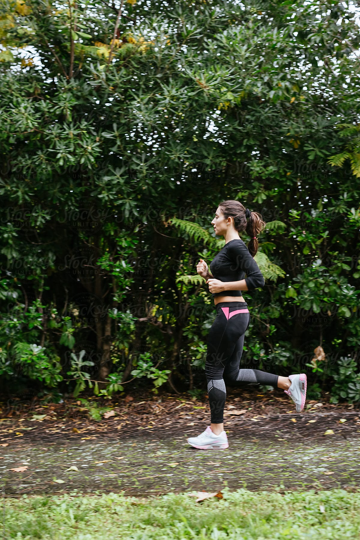 "A Woman Runs Outdoor In A City Garden" by Stocksy Contributor "Mauro ...