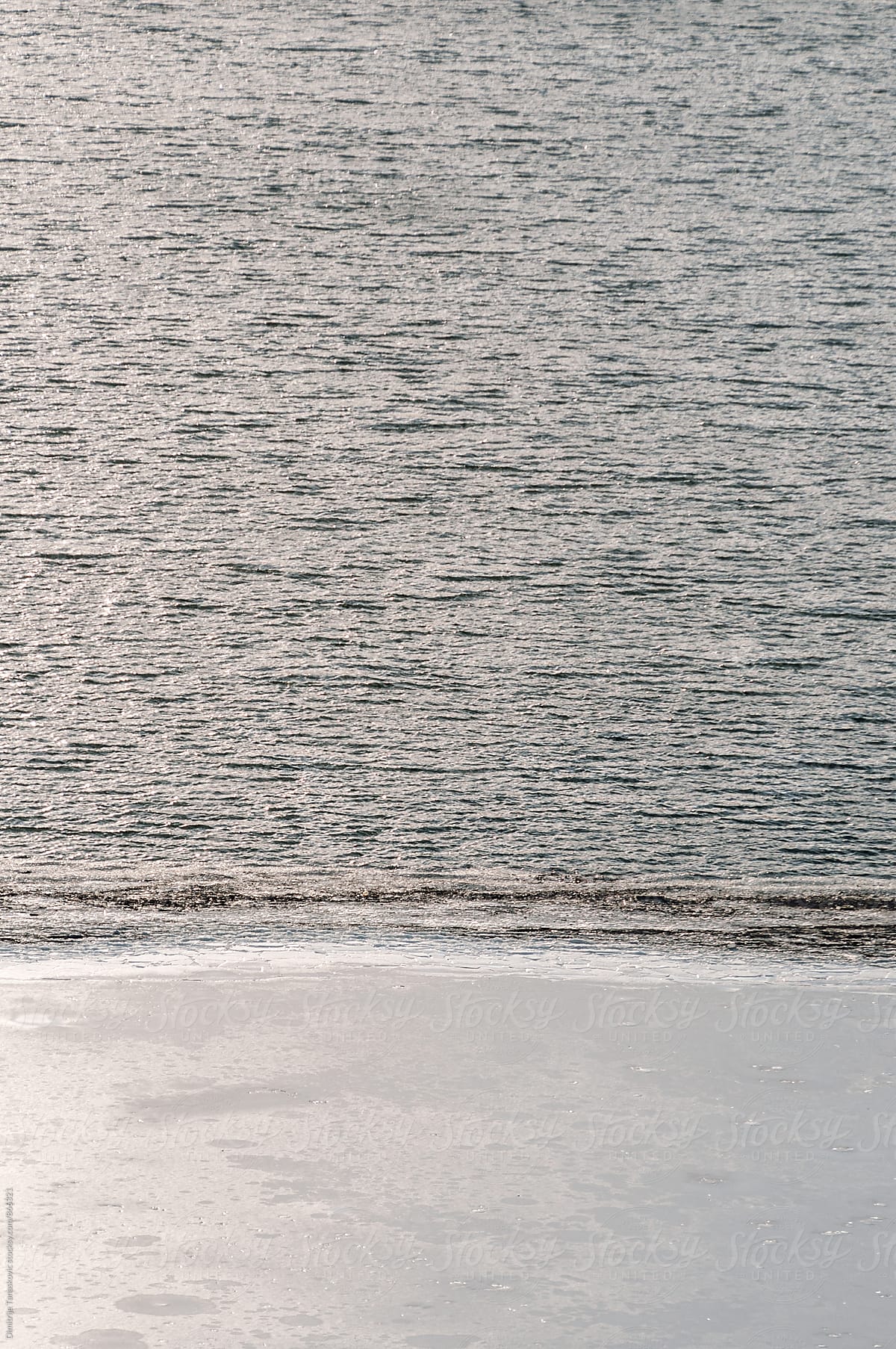 "Partially Frozen Lake Surface" by Stocksy Contributor "Dimitrije ...