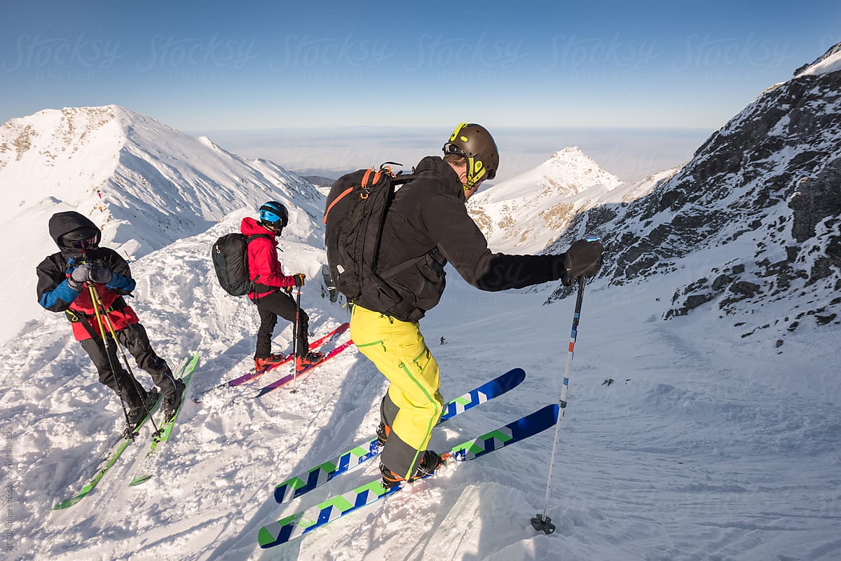 "Three Skiers On Snow-capped Mountain Peak" by Stocksy Contributor ...