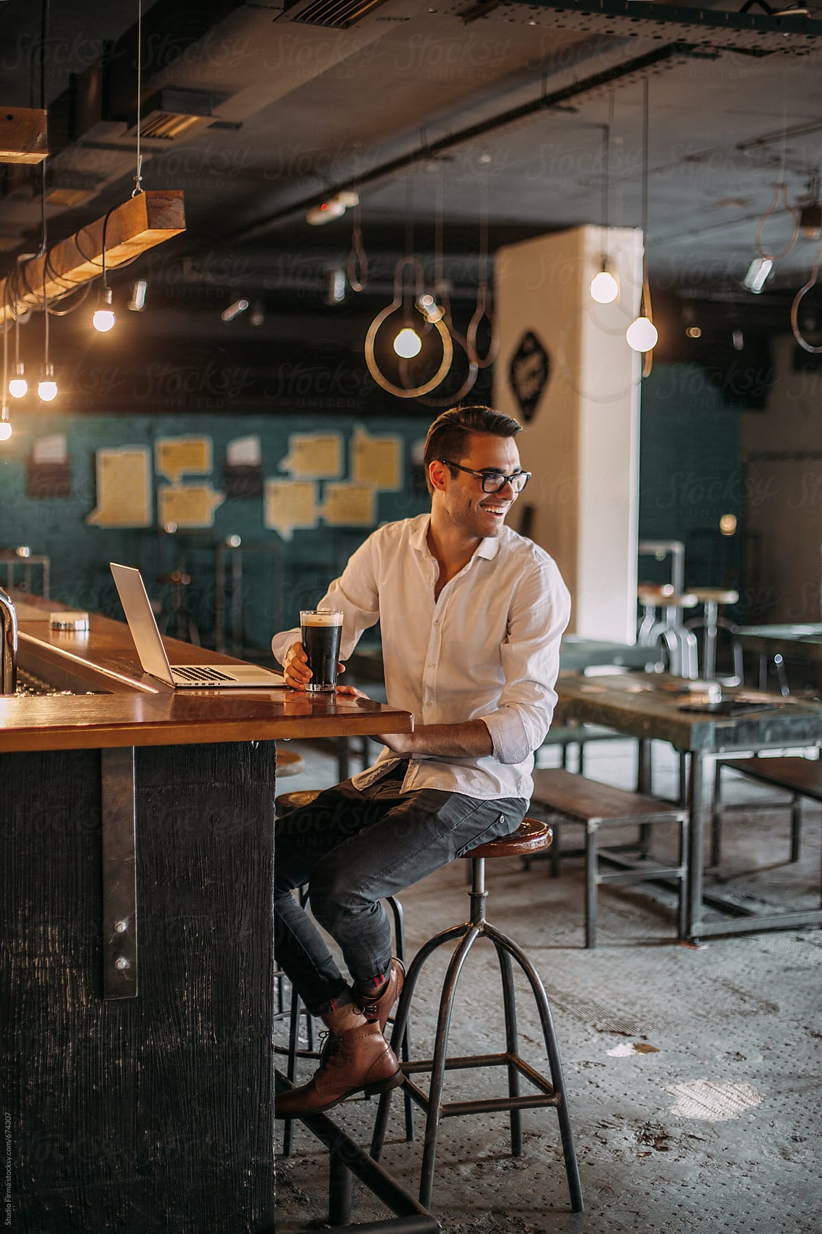 "Stylish Man Sitting In A Bar." by Stocksy Contributor "Studio Firma ...