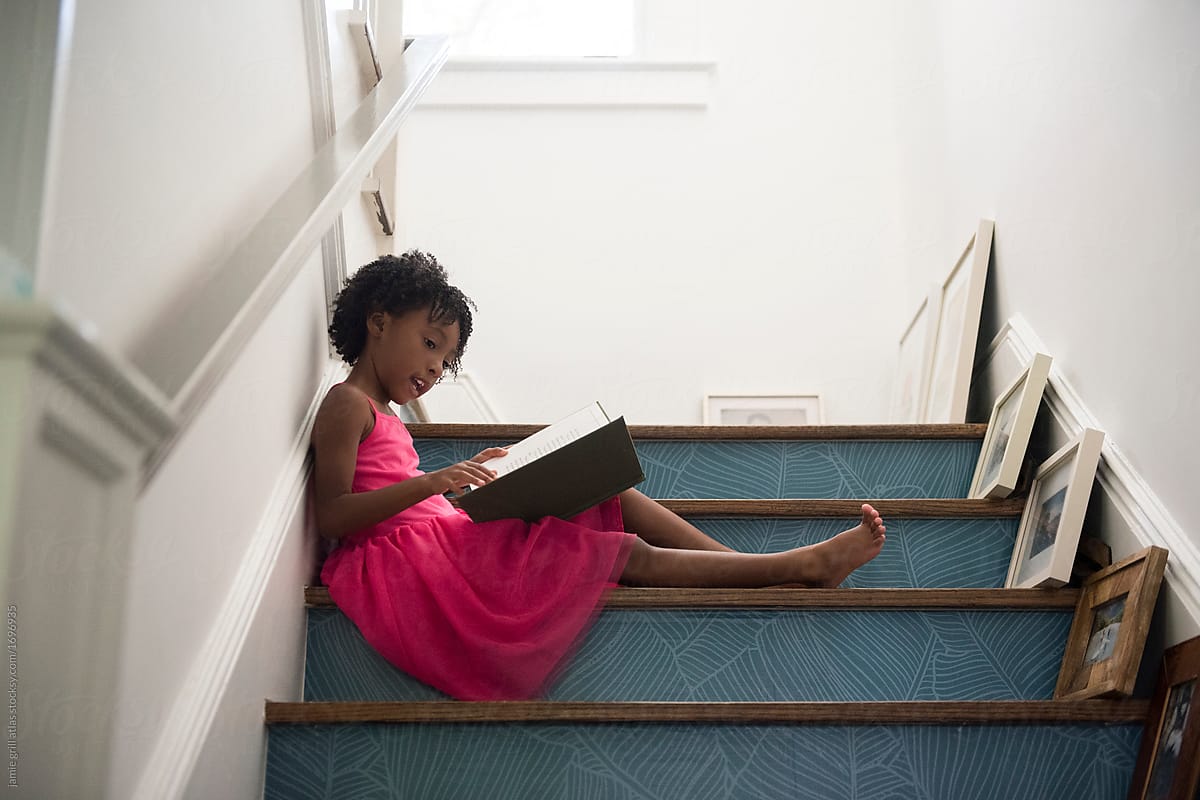 "Girl Reading Book In Staircase" by Stocksy Contributor "Jamie Grill ...