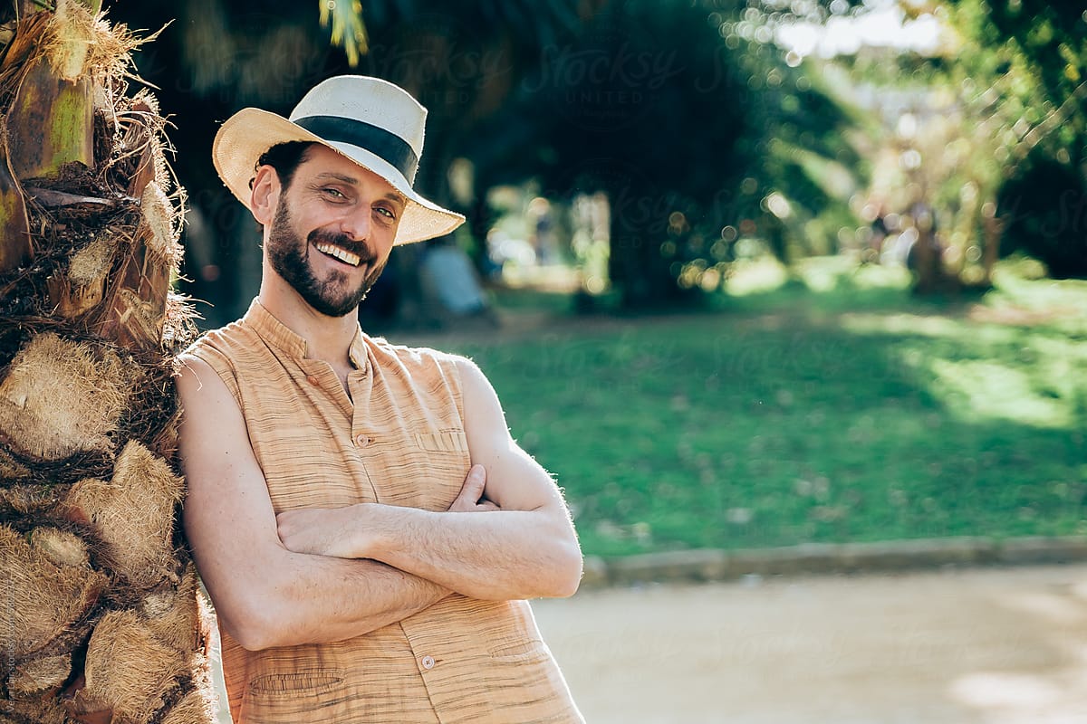 "Nice Man Smiling In A Park" by Stocksy Contributor "Vera Lair" - Stocksy