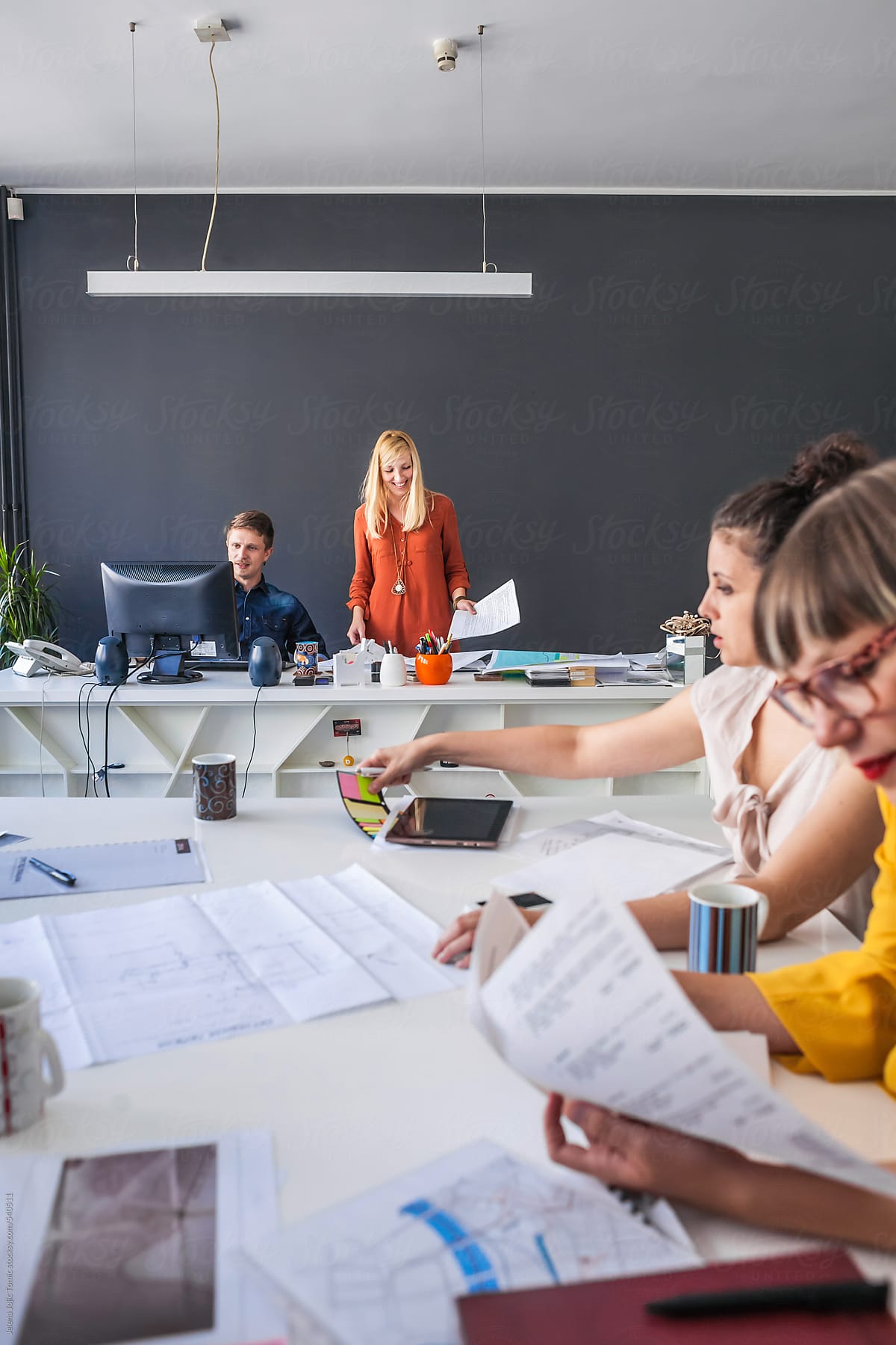 "Day At Work In The Open Office" by Stocksy Contributor "Jelena Jojic ...