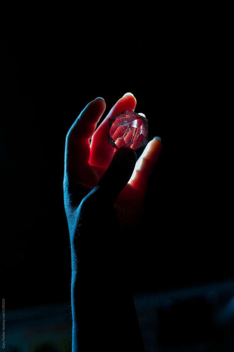 "Hand Holding A Crystal" by Stocksy Contributor "Gary Parker" - Stocksy