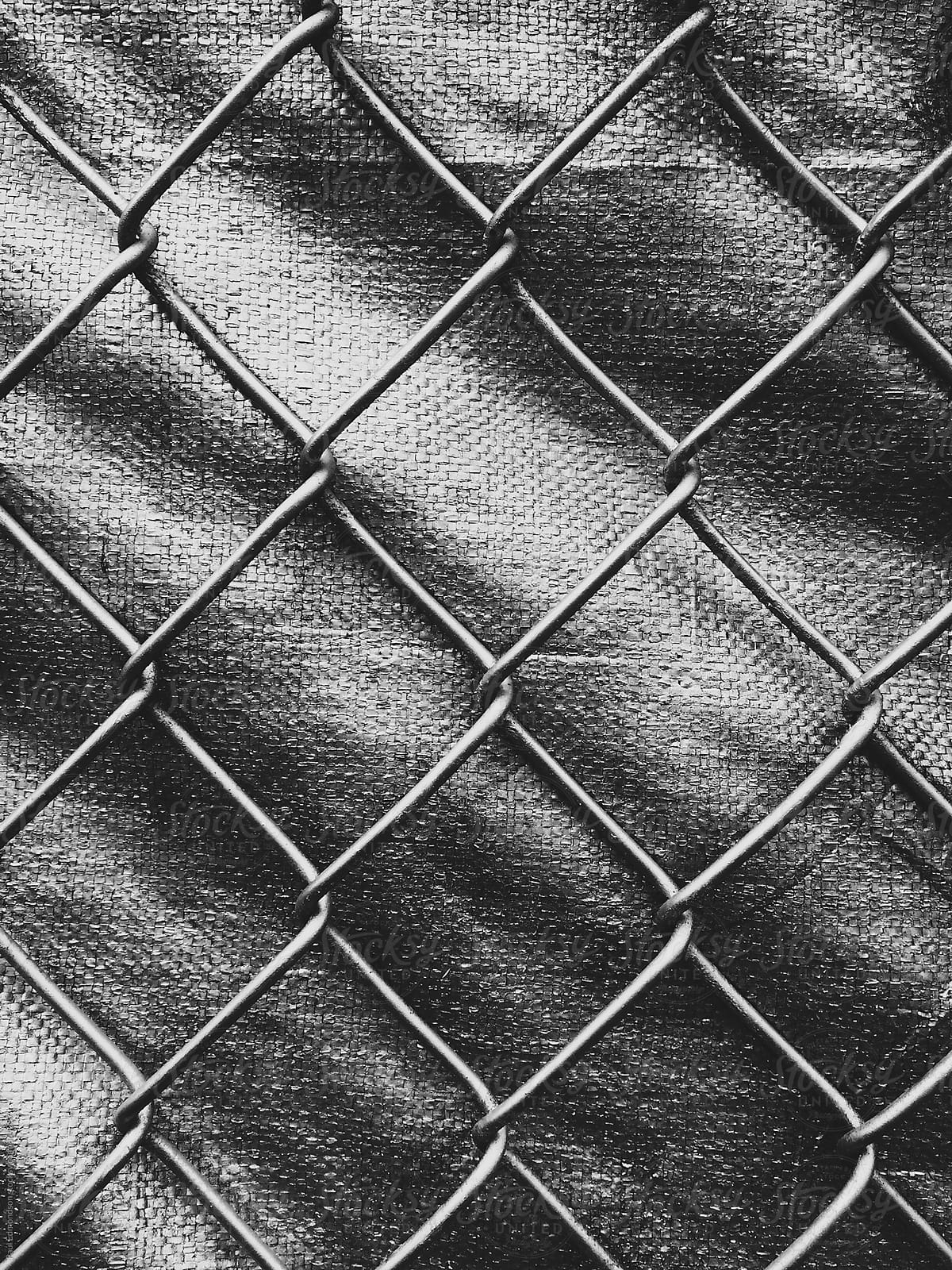 "Close Up Of Chain-link Fence And Silver Tarp" by Stocksy Contributor ...
