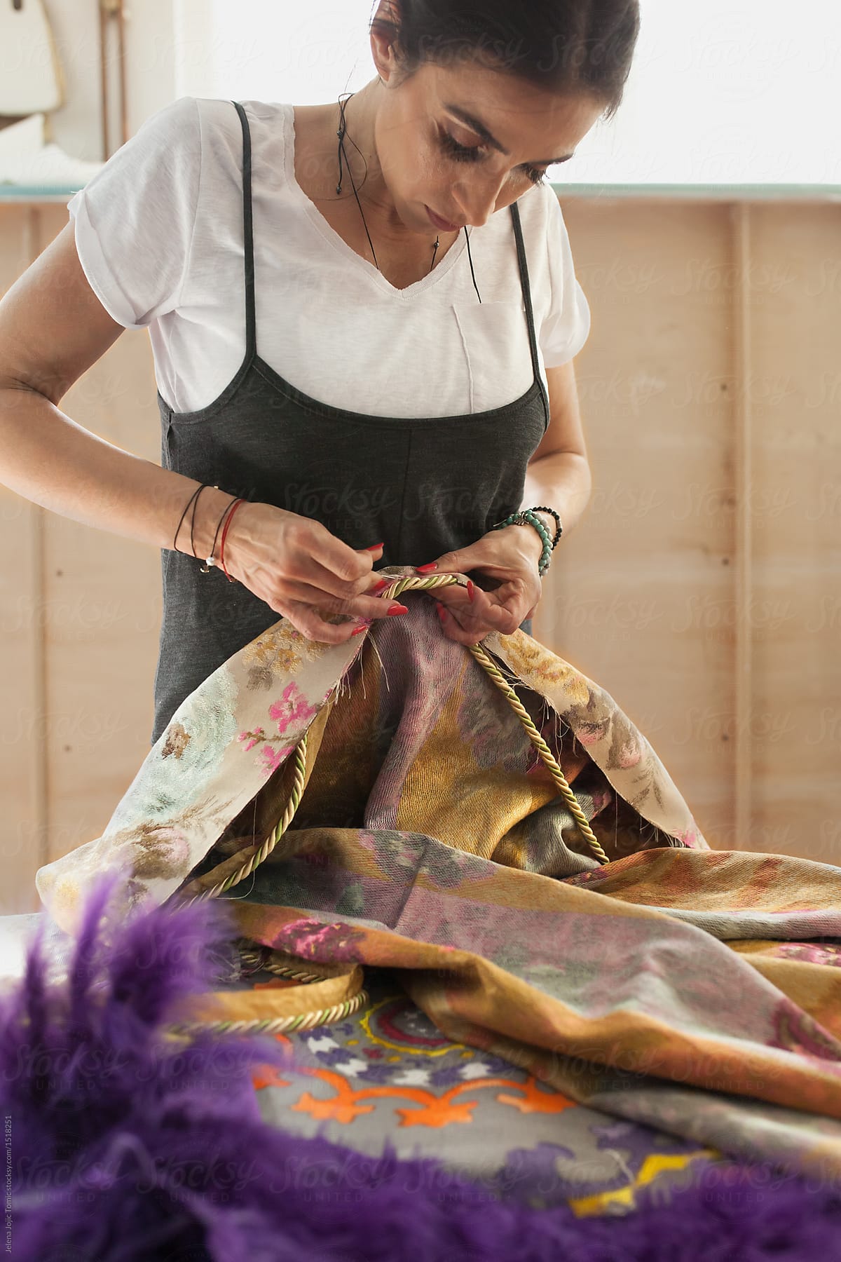 "Woman Sews Textiles By Hand" by Stocksy Contributor "Jelena Jojic ...