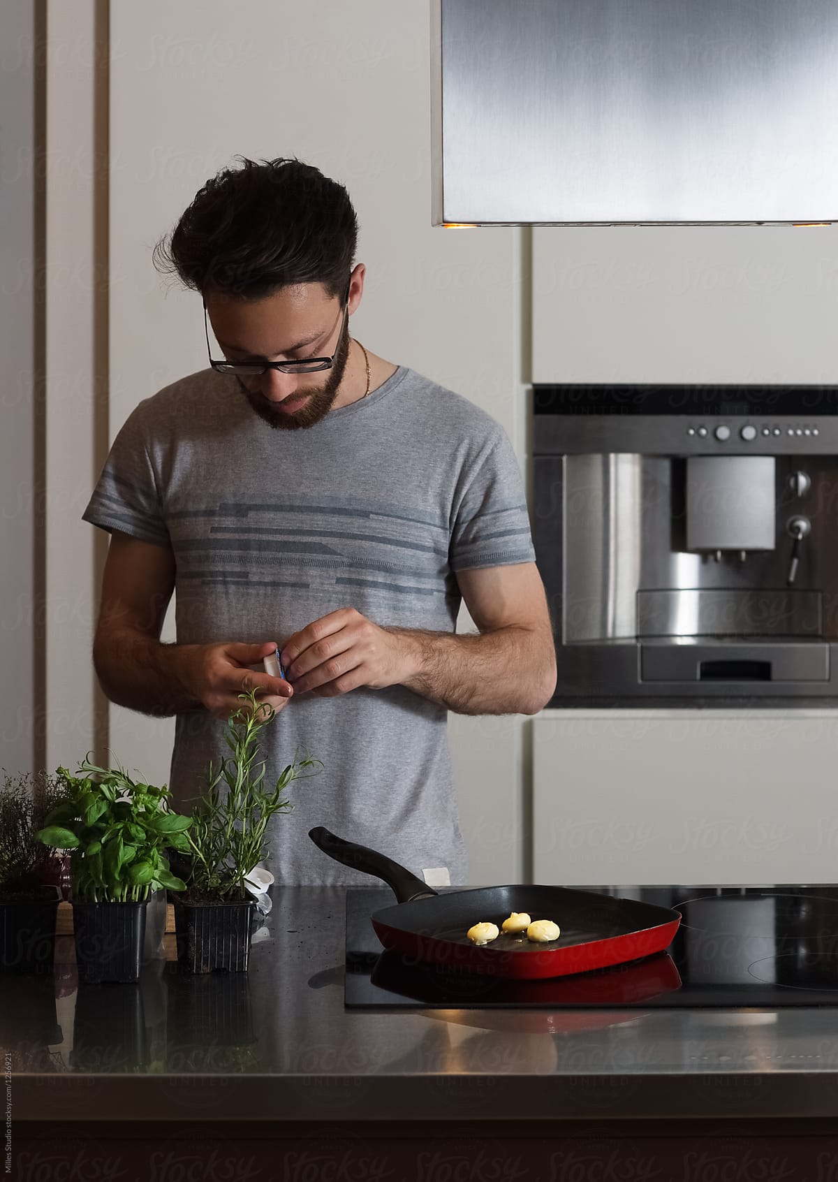 "Man Cooking" by Stocksy Contributor "Milles Team" - Stocksy