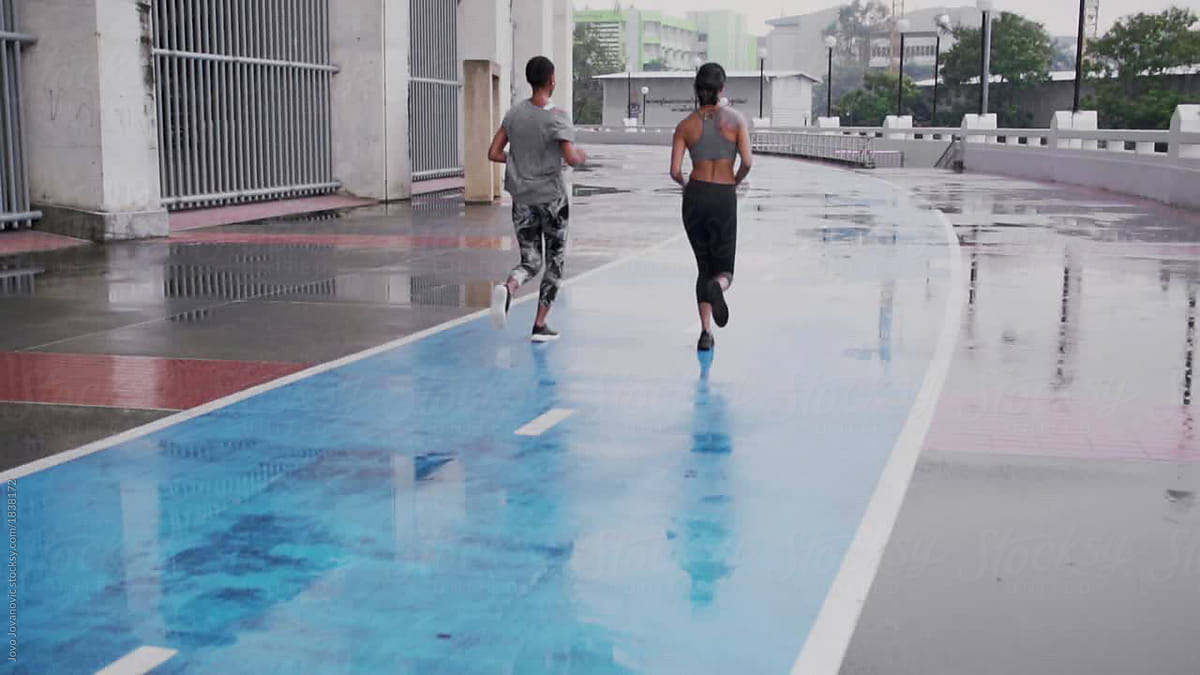 "Two Women Running In The Rain" by Stocksy Contributor "Jovo Jovanovic ...