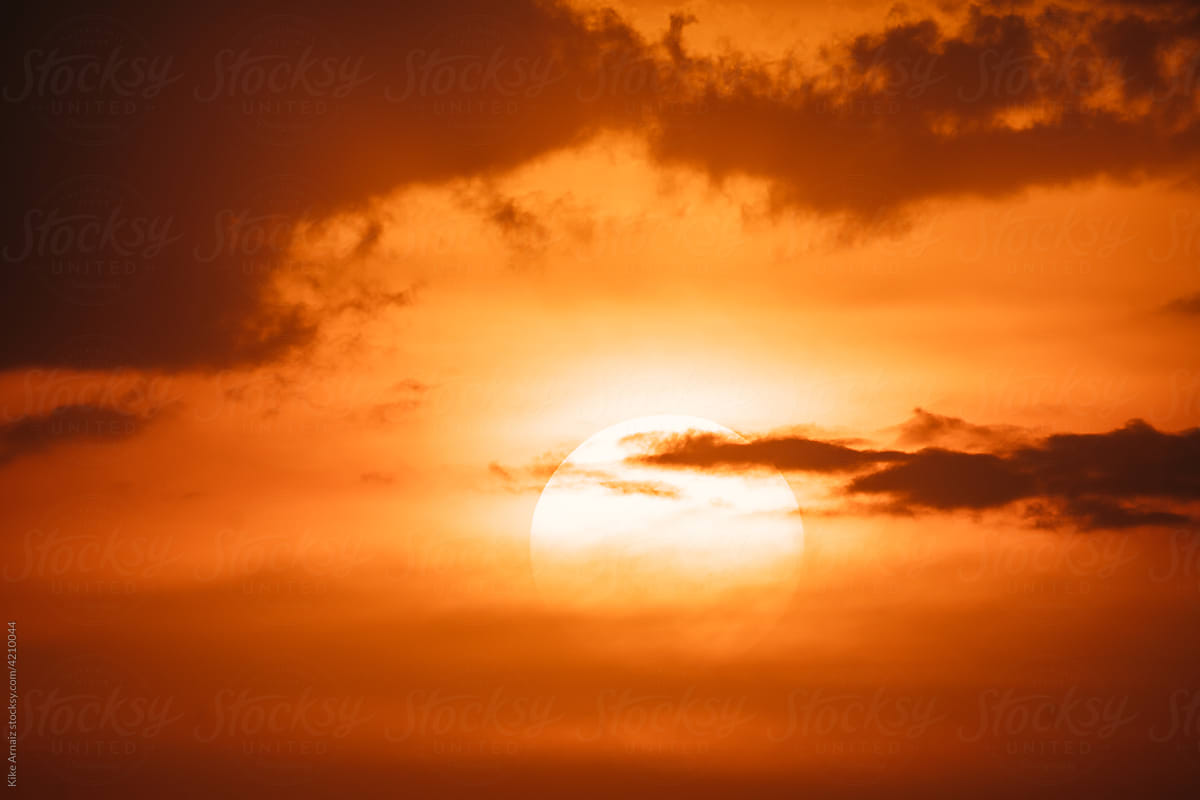 "Bright Sun On Sunset Sky" by Stocksy Contributor "Kike Arnaiz" - Stocksy