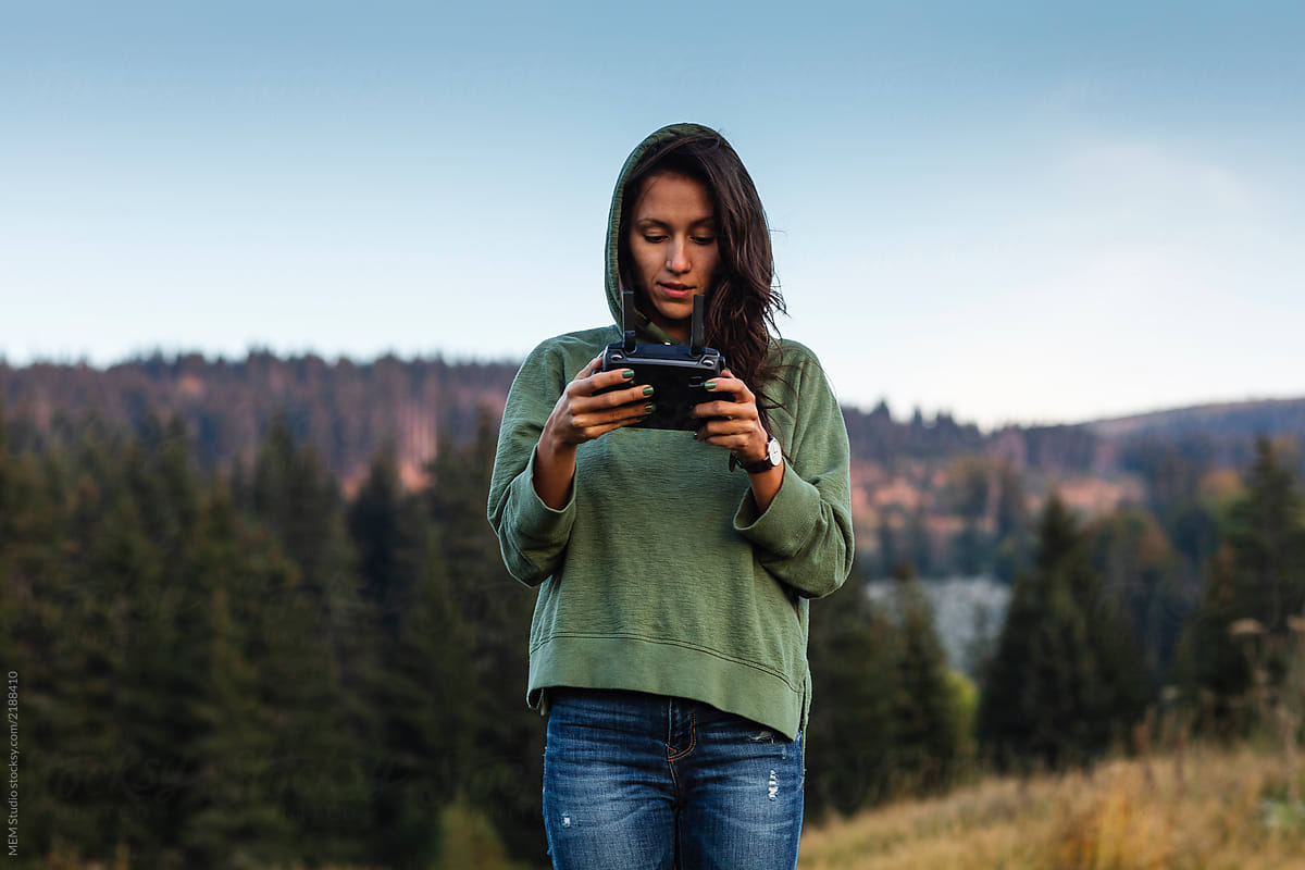 "Young, Beautiful Woman Piloting A Drone" by Stocksy Contributor "MEM ...