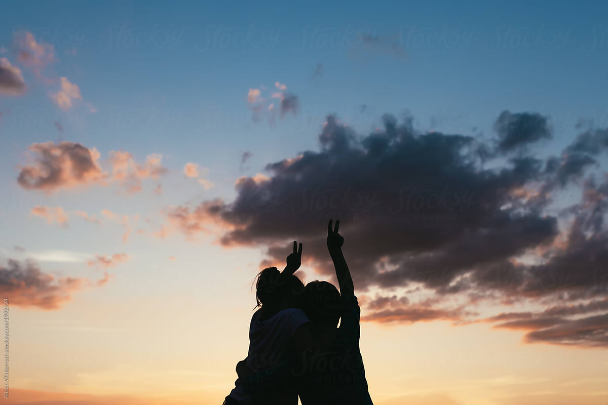 "Two Kids Sport Peace Signs" by Stocksy Contributor "Alison Winterroth ...