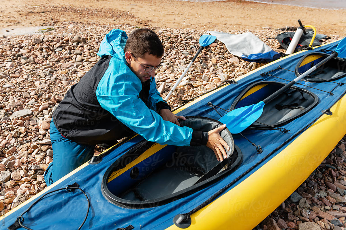 Man preparing seat in boat - Stock Image - Everypixel