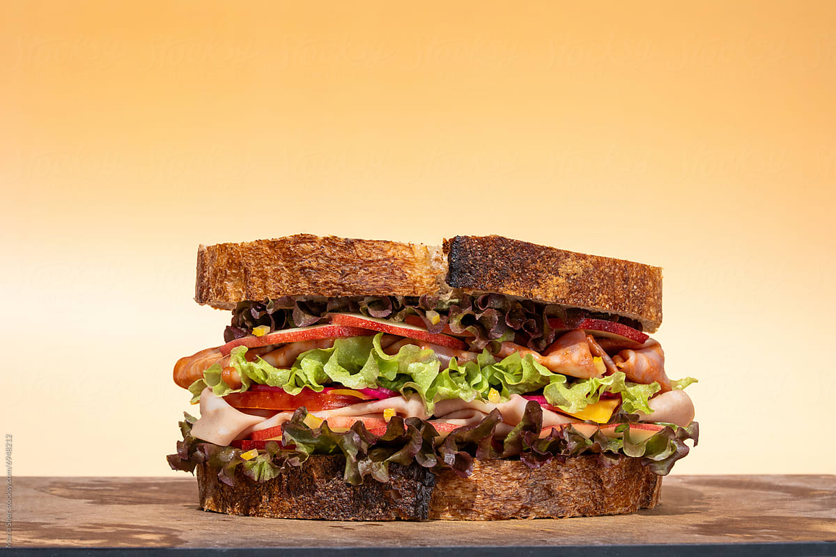 "Delicious Layered Sandwich With Fresh Ingredients At Sunset" by ...