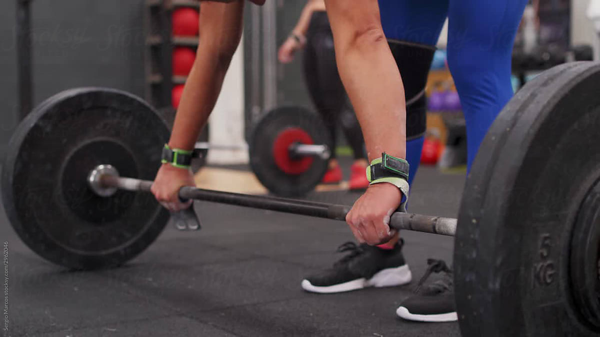"Strong Woman Lifting Heavy Barbell At Crossfit Training" by Stocksy ...