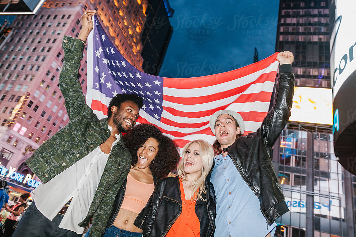 "American Friends Having Fun With A USA Flag In Times Square, Manhattan ...