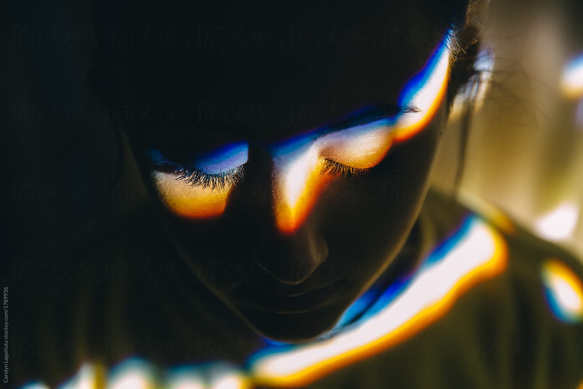 "Female Looking Downward With Light On Her Eyes" by Stocksy Contributor ...