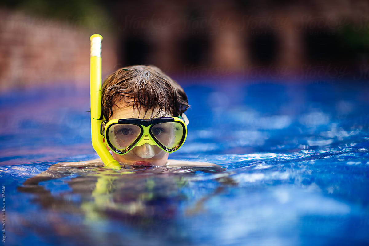 "Boy Wearing A Snorkel Set In A Pool" by Stocksy Contributor "Angela ...