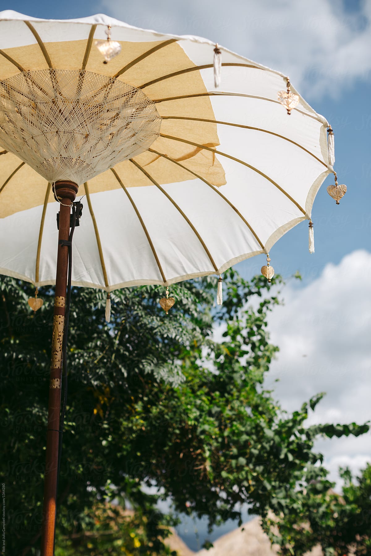 "Sun Umbrella With Tassles" by Stocksy Contributor "Rob And Julia ...