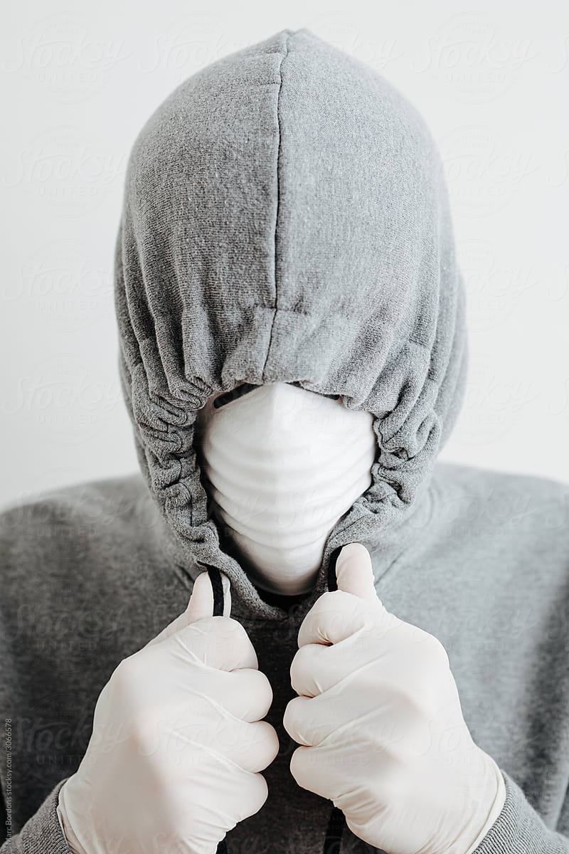 "A Hypochondriac Person Covering His Head With A Hood. He Wears Gloves ...