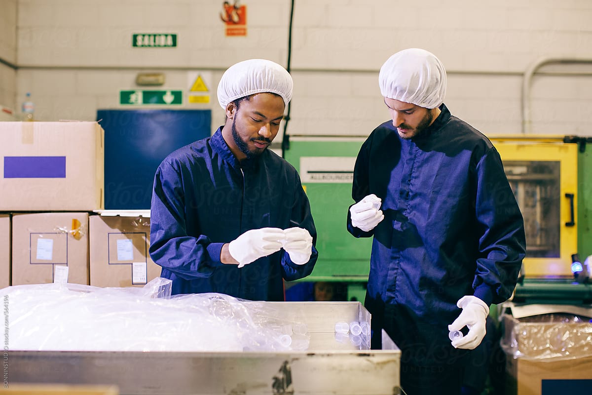 "Two Male Co-workers Working In A Factory." by Stocksy Contributor ...